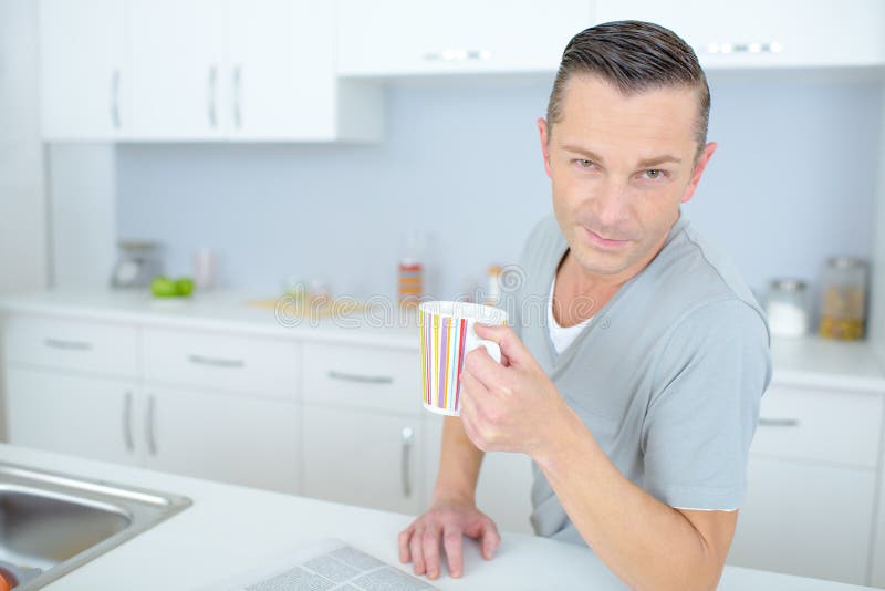 Young Man Smiling and Holding Cup Tea Stock Image - Image of home ...