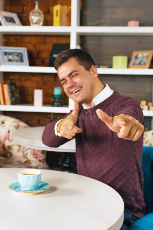 Young Man Smiling and Pointing at You with Both Hands Stock Photo ...