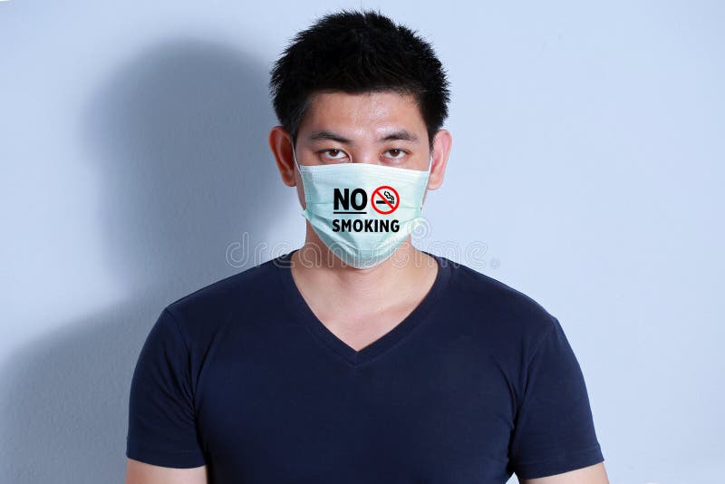 Young Man Smoking Cigarette with Protective Mask Stock Image - Image of ...