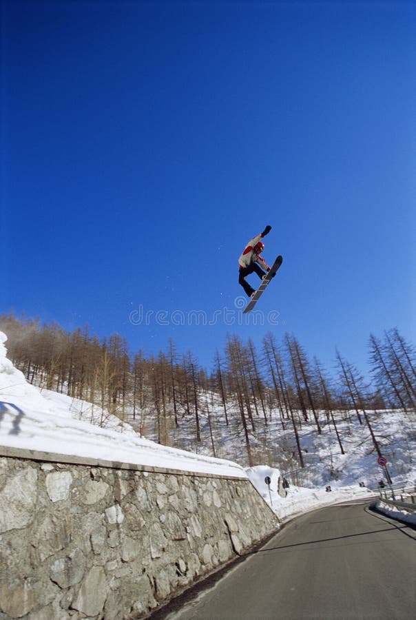 Young man snowboarding stock image. Image of thrill, slope - 6077351
