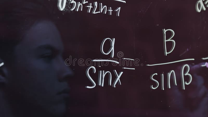Young Man Solves Equations. Media. Close-up of Young Man& X27;s ...