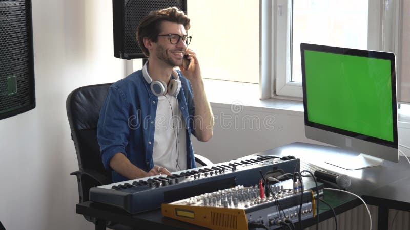Young Man in Sound Recording Studio. Guy Sit in Front Keyboard and ...