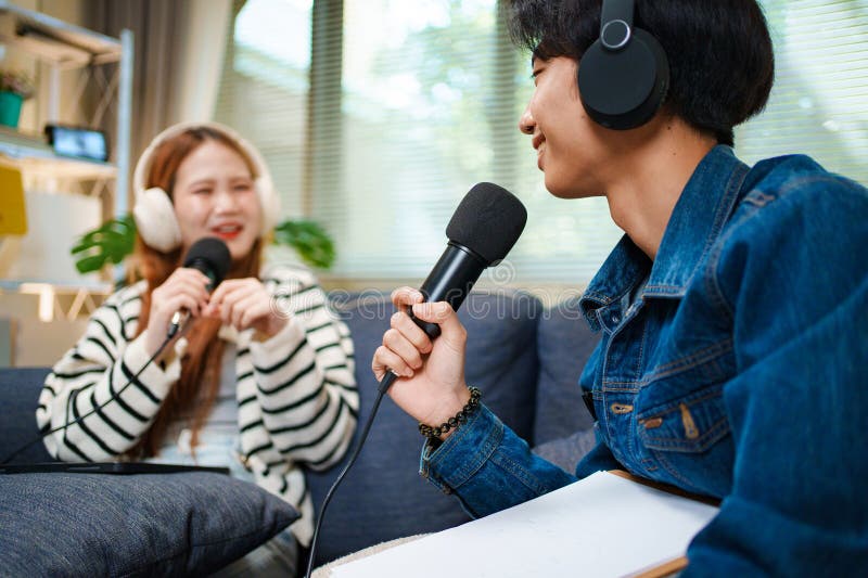 Young Man Speaking in Podcast with Headphones and Microphone at Home ...