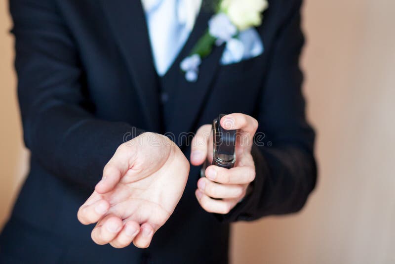 Young man spray perfume stock photo. Image of success - 72319912