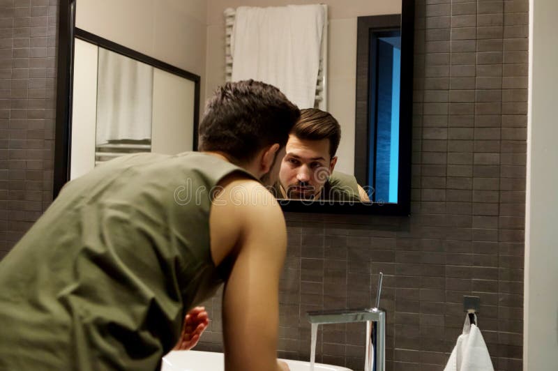 Young Man Spraying Water on His Face. Stock Photo - Image of person ...
