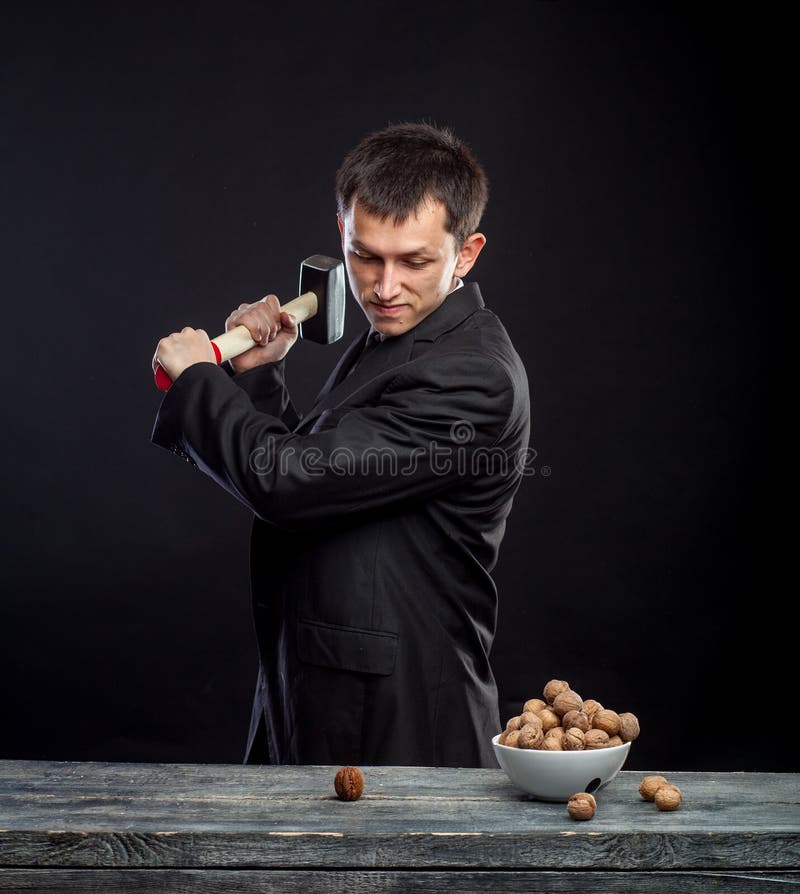 Young man stabs a nut stock image. Image of frustration - 54482381