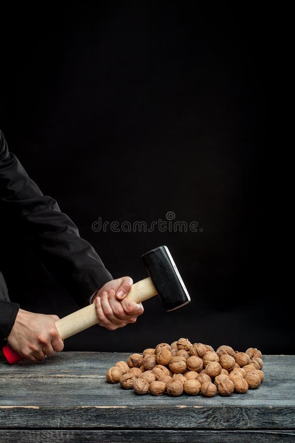 Young man stabs a nut stock image. Image of huddle, hill - 54505297
