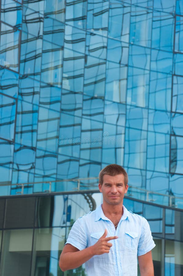 Young Man Stand in Front of Modern Business Building Stock Photo ...