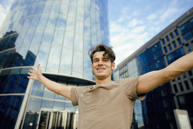 Young Man Stand in Front of Modern Business Building Stock Photo ...