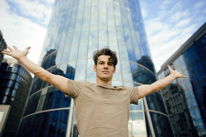 Young Man Stand in Front of Modern Business Building Stock Photo ...