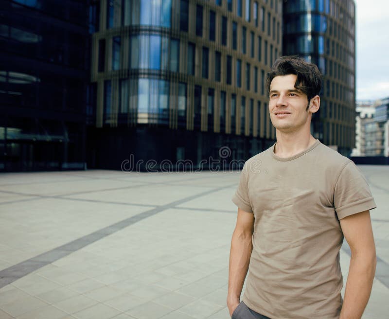 Young Man Stand in Front of Modern Business Building Stock Photo ...