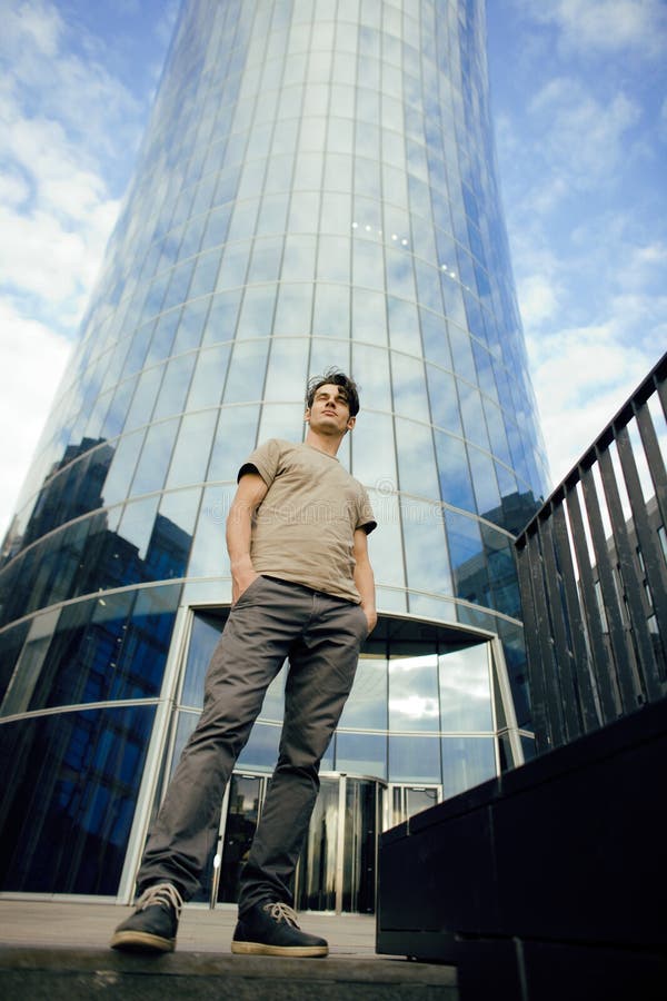Young Man Stand in Front of Modern Business Building Stock Photo ...