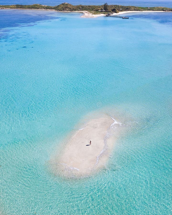 Young Man Standing Alone on a Tropical Island Surrounded by a Crystal ...