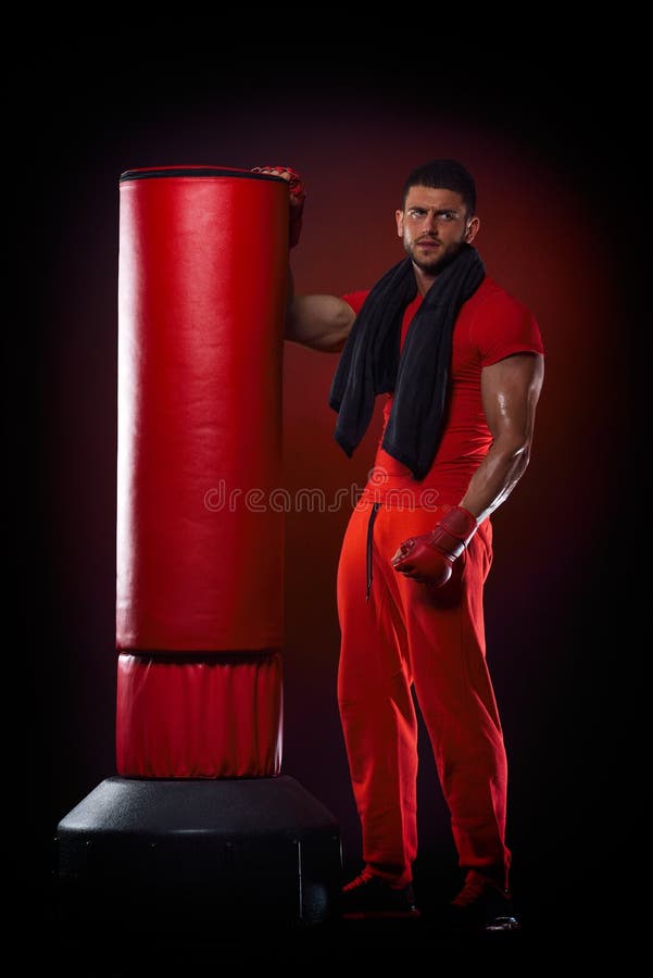 Young Man Standing by Boxing Bag Stock Photo - Image of athletic ...