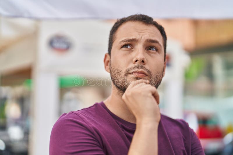 Young Man Standing with Doubt Expression at Street Stock Image - Image ...
