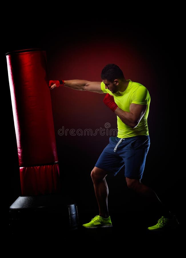 Young Man Standing Exercising with Boxing Bag Stock Photo - Image of ...