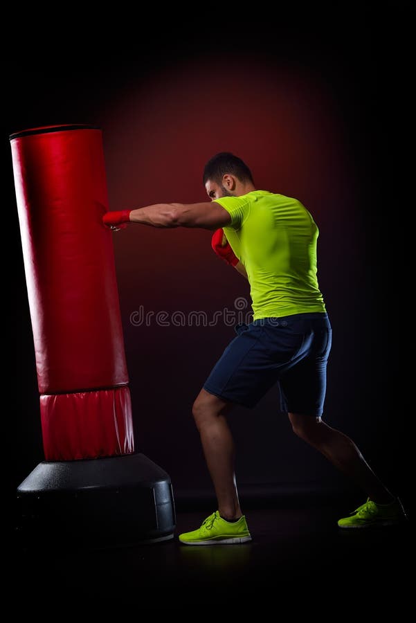 Young Man Standing Exercising with Boxing Bag Stock Photo - Image of ...