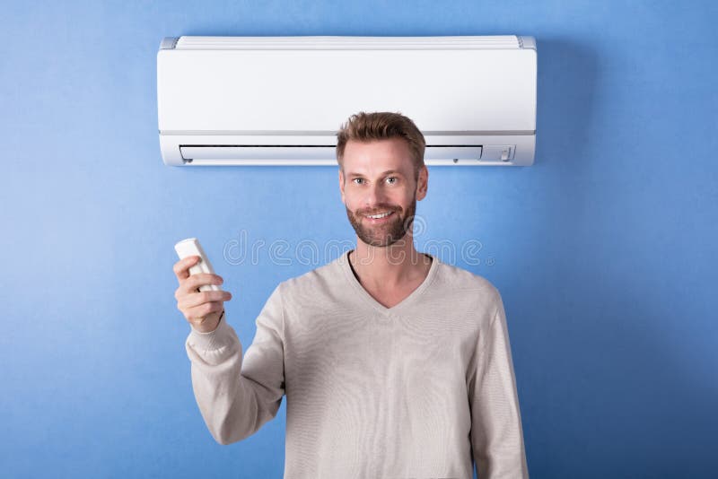 Young Man Standing in Front of Air Condition Stock Image - Image of ...