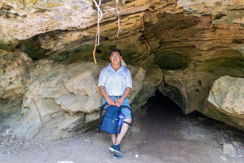 Young Man Standing Inside of a Cave Stock Photo - Image of island ...