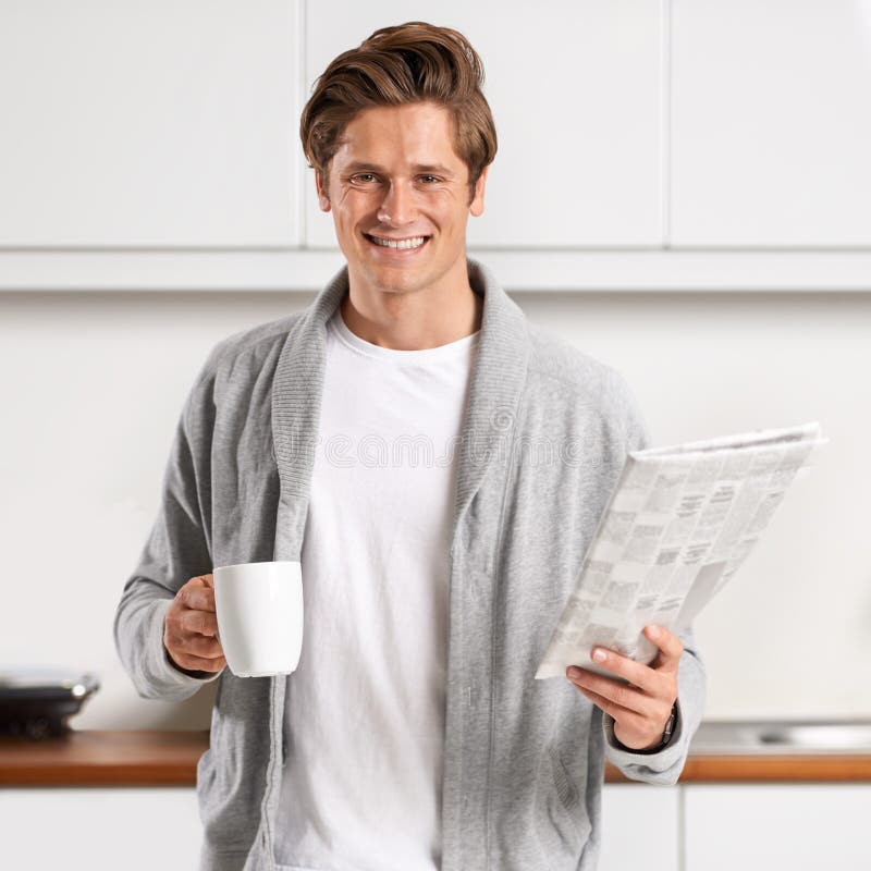 My Morning Ritual.... a Young Man Standing in a Kitchen Drinking Coffee ...