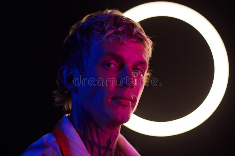 Young Man Standing in Neon Light Stock Photo - Image of person ...