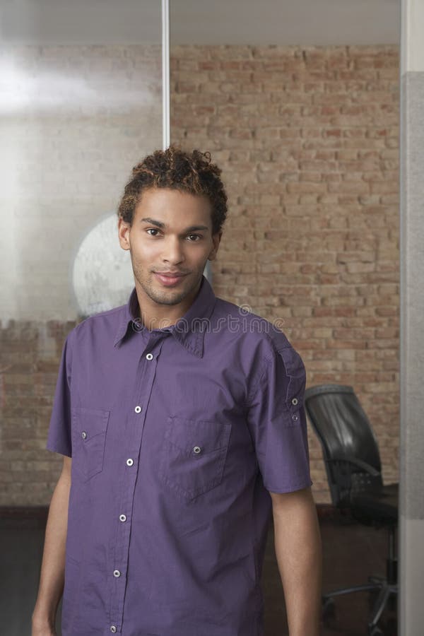 Young Man Standing in Office Stock Photo - Image of standing, berlin ...