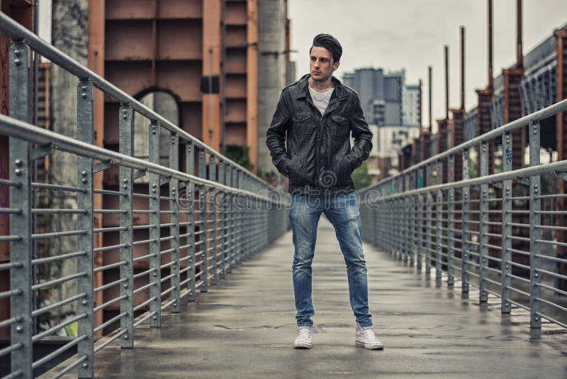 Young Man Standing Outdoors in Urban Setting Stock Image - Image of ...