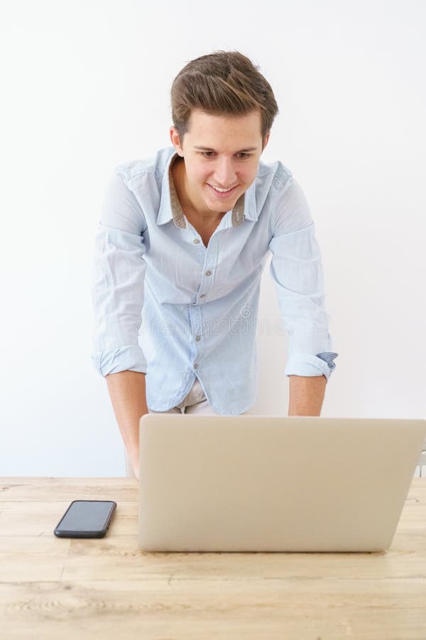 Young Man Standing Pointing at the Laptop Stock Photo - Image of woman ...