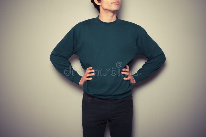 Young Man Standing in a Powerful Pose Stock Image - Image of tint ...