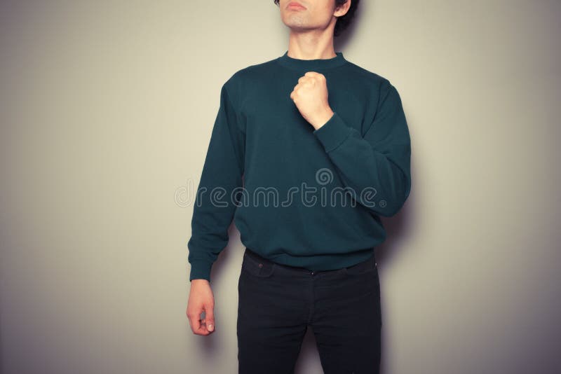 Young Man Standing in a Powerful Pose Stock Photo - Image of young ...
