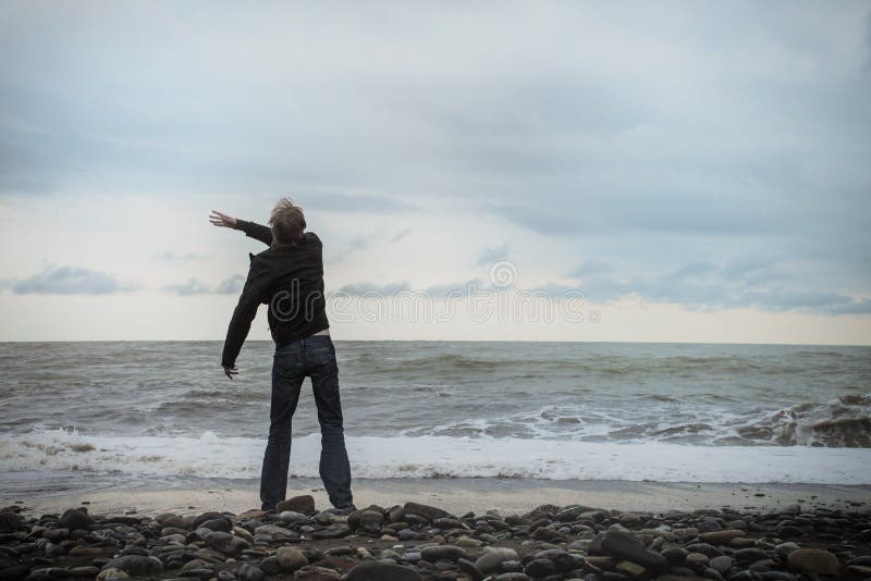 Young Man Standing on the Sea Shore Stock Photo - Image of people ...