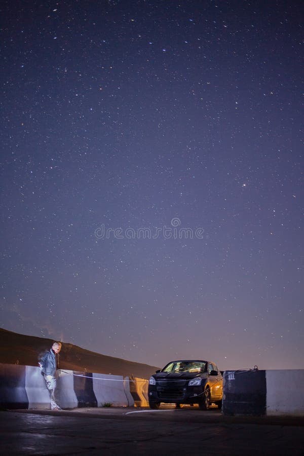 The Guy Stands at Night in a Forest with a Lighted Kerosene Lamp Stock ...
