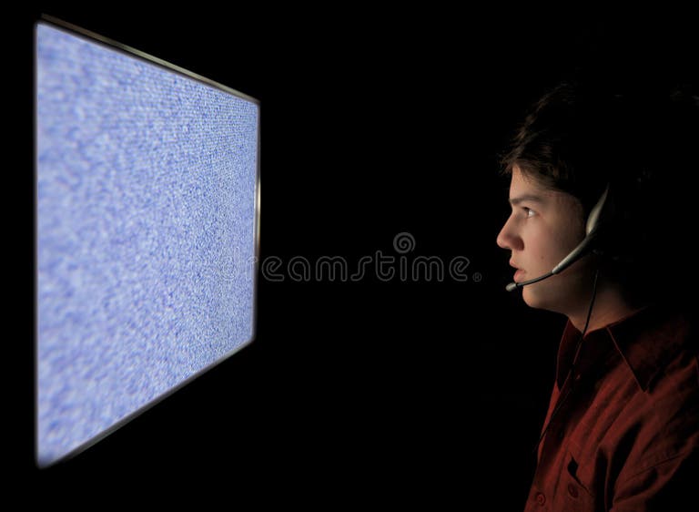 Young Man Staring into Static TV Computer Screen Stock Photo - Image of ...
