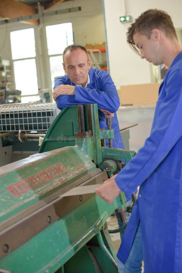 Young Man with Stationary Machine Stock Photo - Image of lathe, insert ...