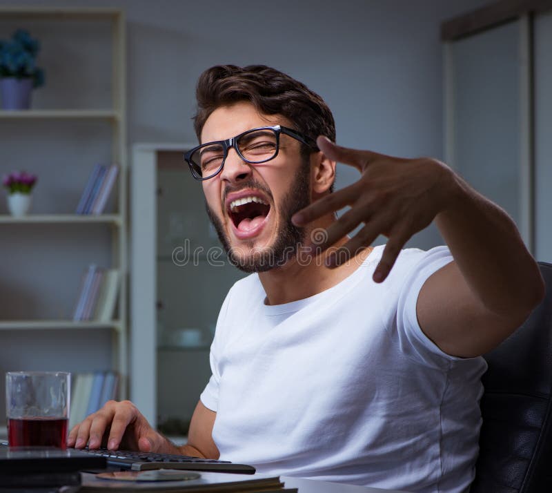 Young Man Staying Late in Office To Do Overtime Work Stock Image ...