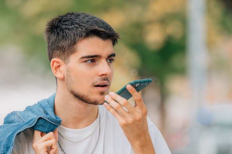 Young Man in the Street with Mobile Phone Stock Photo - Image of ...