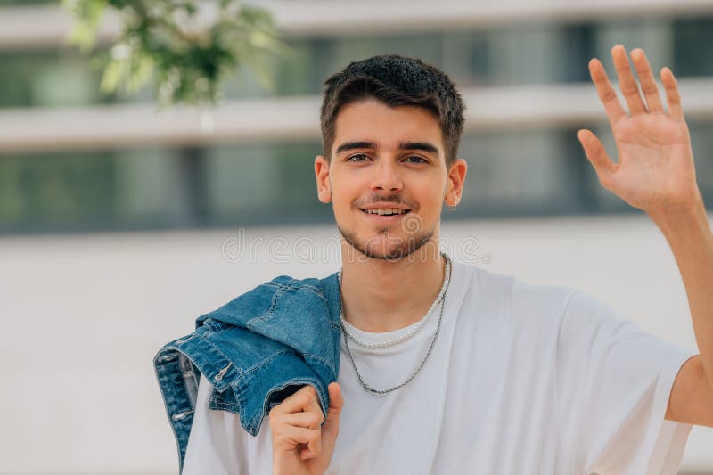 Young Man on the Street Waving Stock Image - Image of gesture, hello ...