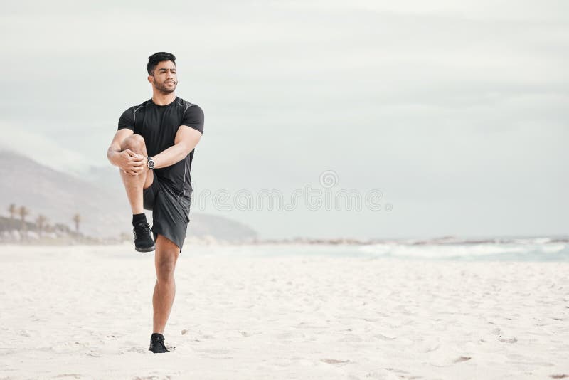 Stretch Your Day by Starting it with a Workout. a Young Man Stretching ...