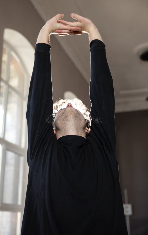 Young man stretching hands stock image. Image of male - 51631233