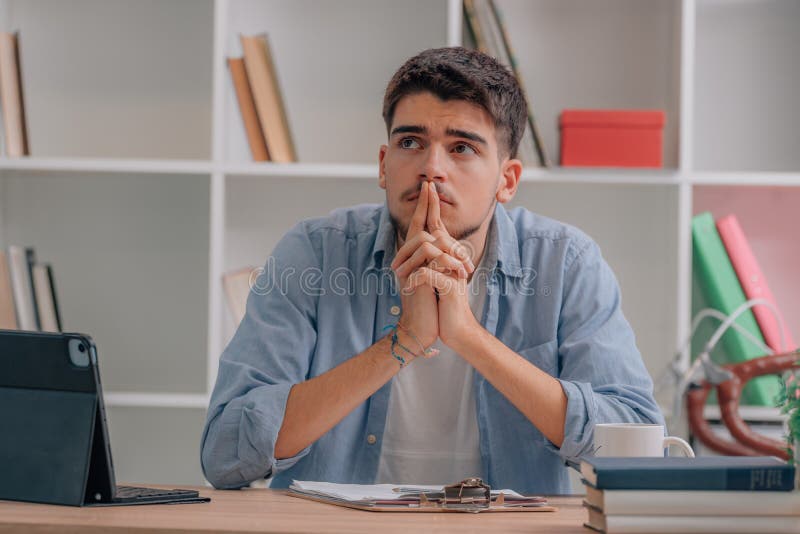 Man or Student at Desk with Laptop Thinking with Doubt or Deciding ...