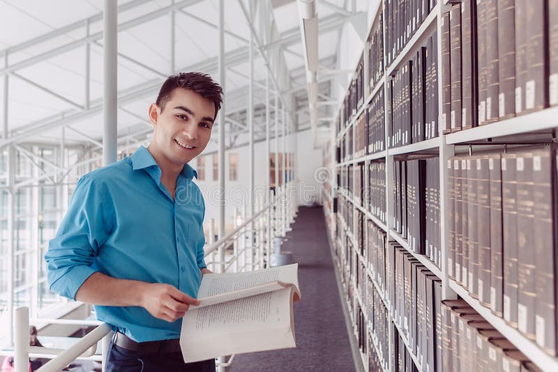 Young Man Student Learning Reading a Book at Library Stock Image ...