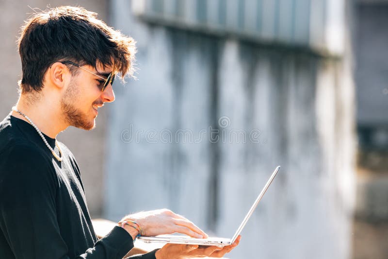 Young Man or Student in the Street with Laptop Stock Image - Image of ...