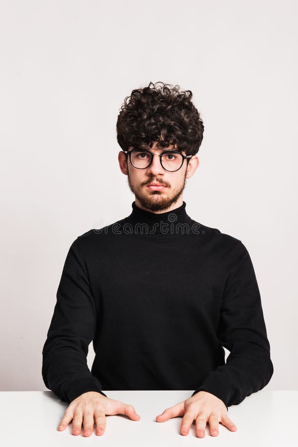 Young Man in a Studio, Sitting at the Table. Stock Image - Image of ...
