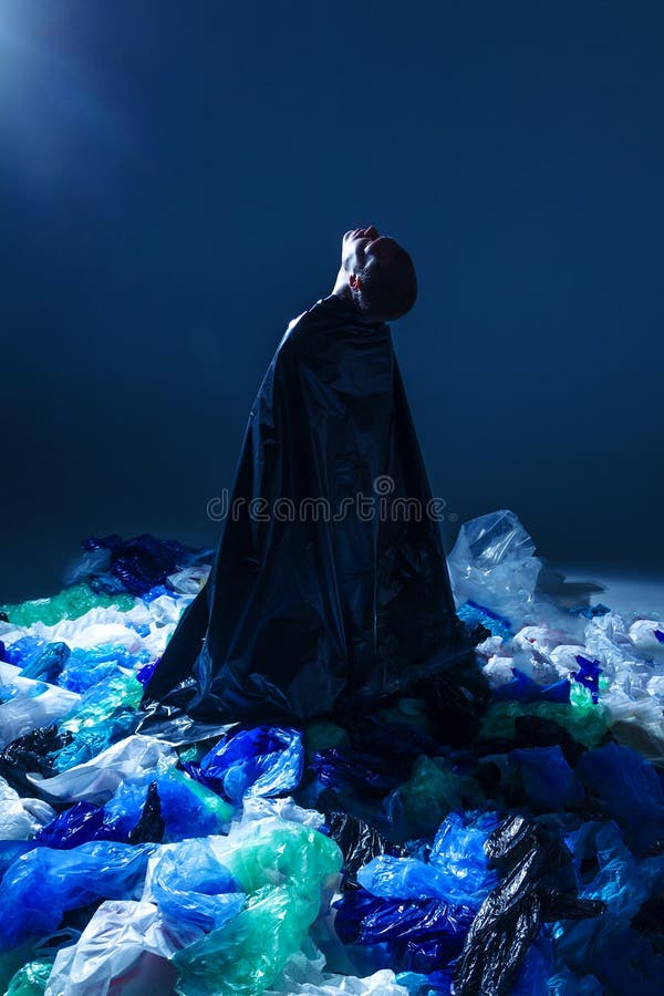 Young Man in Studio, Surrounded by Empty Plastic Garbage Bags. Content ...