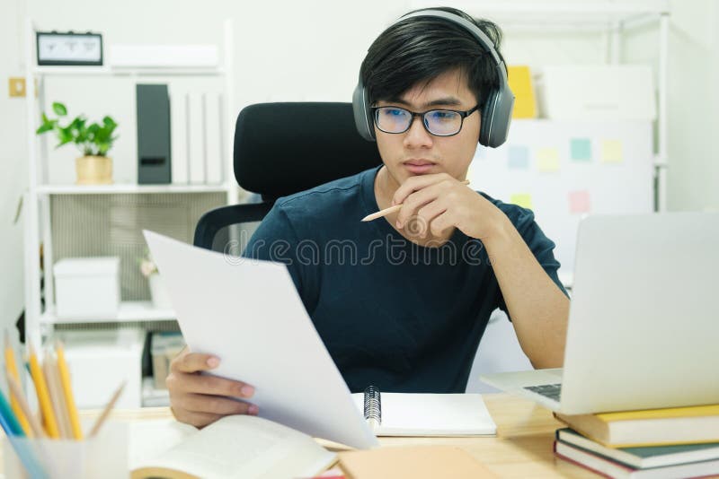 Young Man Study in Front of the Laptop Computer at Home Stock Image ...
