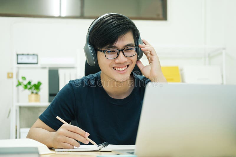 Young Man Study in Front of the Laptop Computer at Home Stock Photo ...