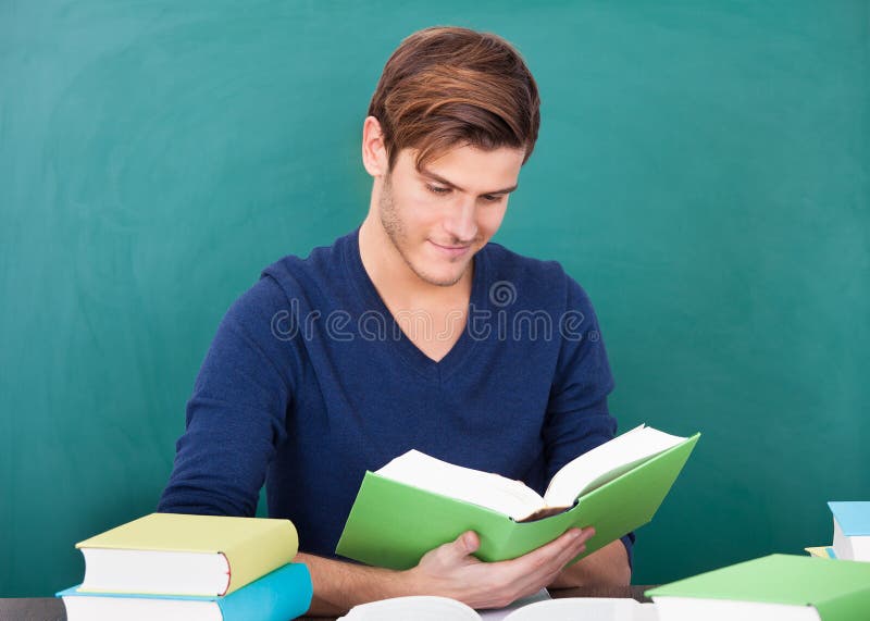 Young Man Studying in Classroom Stock Photo - Image of male, geek: 56911116