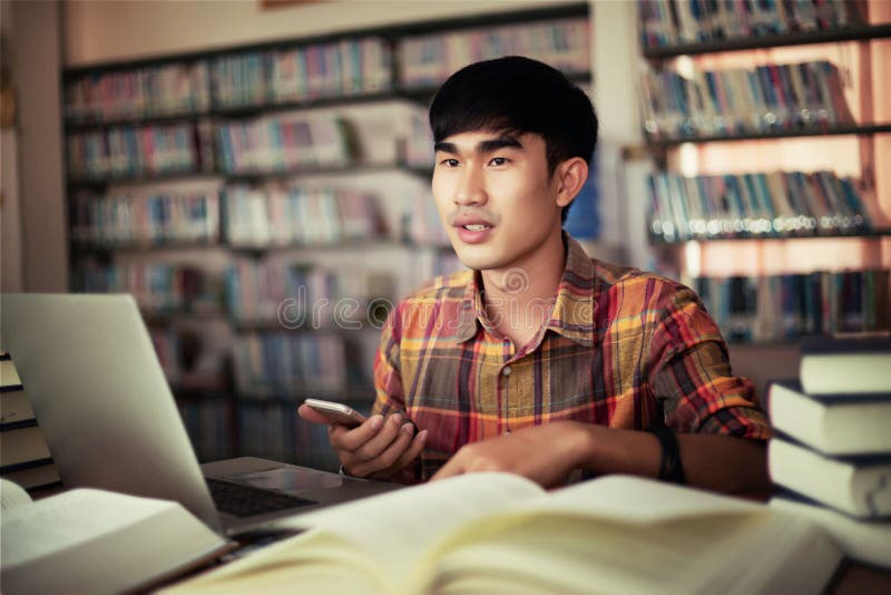 The Young Man is Studying for Knowledge in the Library Stock Image ...