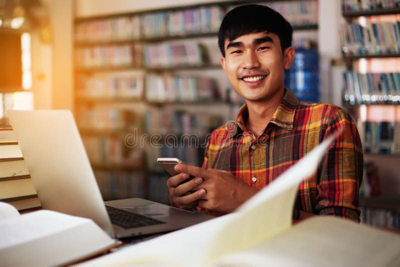 The Young Man is Studying for Knowledge in the Library Stock Photo ...