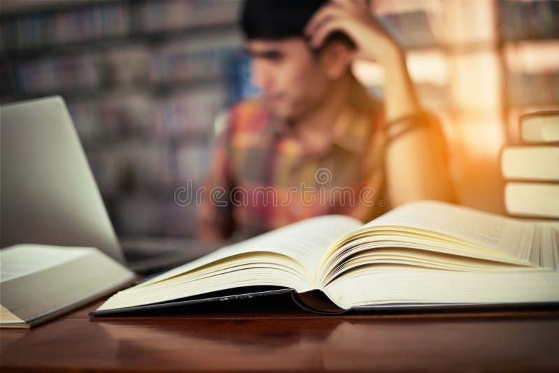The Young Man is Studying for Knowledge in the Library Stock Image ...